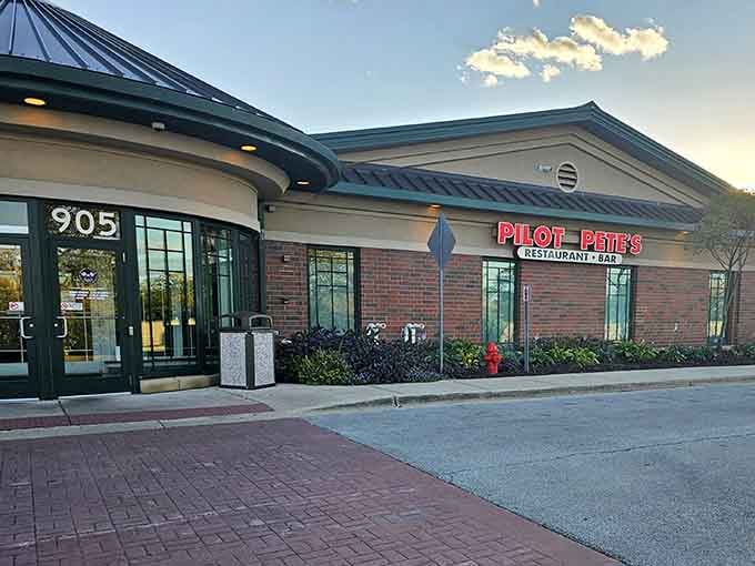 The brick facade and aviation signage promise exactly what's inside: honest American food with a side of runway views that beat any TV screen.