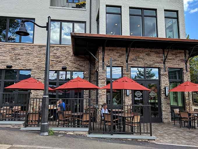 Stone, wood, and those cheerful red umbrellas create the perfect stage for your barbecue adventure to begin.