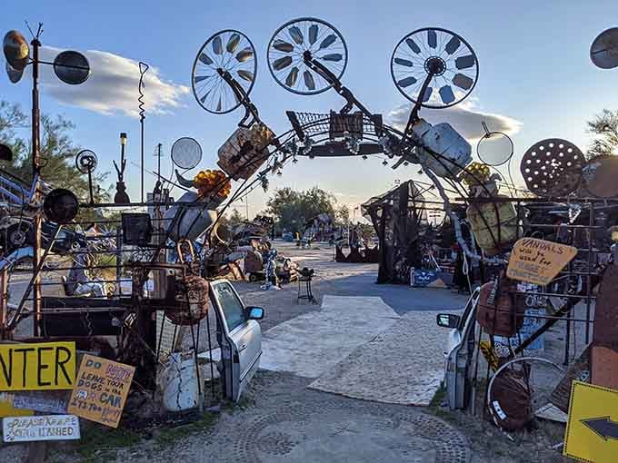 When your entrance arch is made from fan blades and car parts, you know you're somewhere gloriously weird.