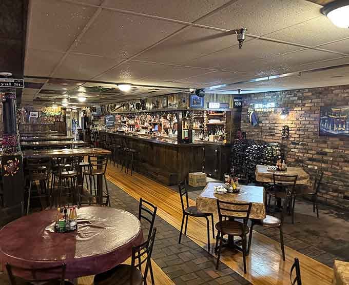 The bar beckons with promises of craft cocktails while exposed brick whispers tales of countless memorable meals shared.