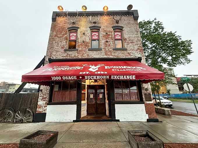 That weathered brick and bold red awning have been welcoming hungry souls since Colorado was still figuring itself out.
