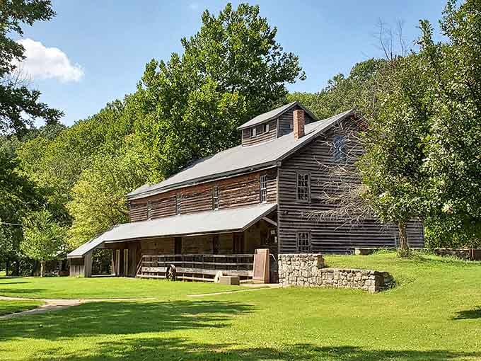 The Jolly Mill stands proud against lush greenery, a testament to craftsmanship that modern construction can only envy.
