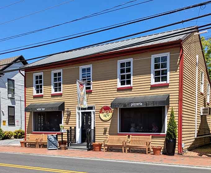 That yellow exterior with red trim isn't just charming&mdash;it's basically waving you down from the street.