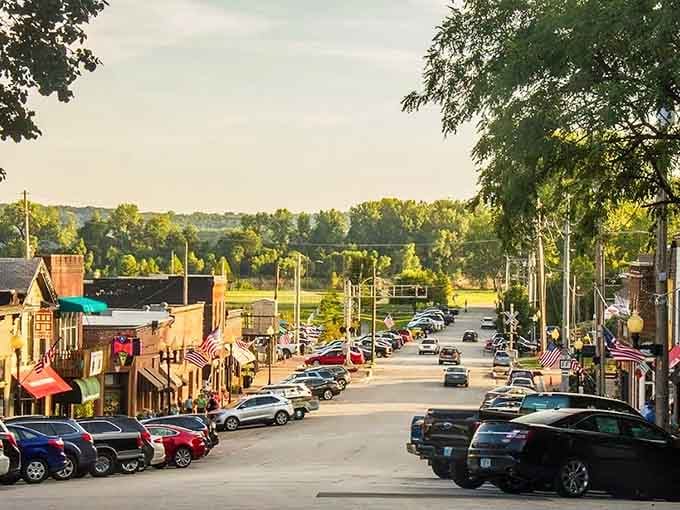 Golden hour transforms Main Street into a Norman Rockwell painting, complete with flags and that perfect small-town glow.