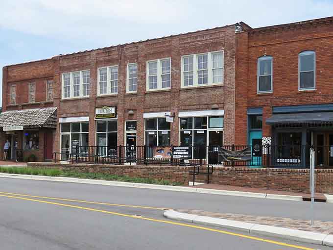 Classic brick storefronts line the street like a postcard from when downtowns actually meant something special.