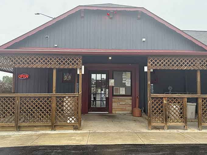 That barn-style exterior with lattice work isn't fancy, but it's hiding some seriously spectacular steaks inside.