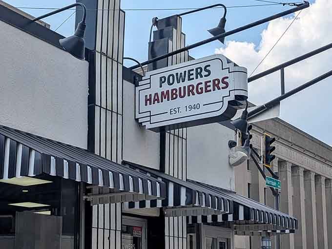 That classic striped awning welcomes everyone equally, from first-timers to folks who've been coming here for decades.