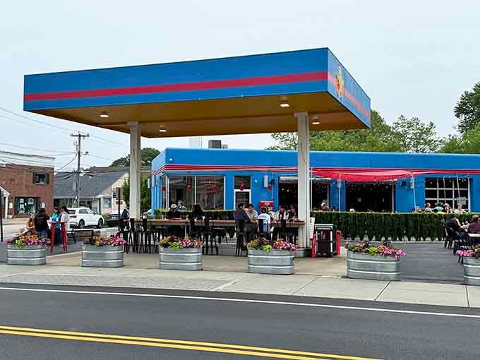 That bright blue exterior isn't trying to hide its gas station past, it's celebrating a delicious transformation.