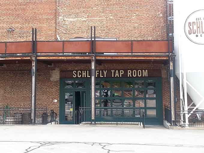 That brick facade and those green-trimmed entrance are calling your name louder than your GPS ever could.