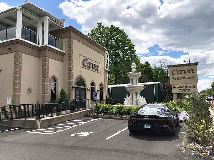 Mediterranean elegance meets suburban Connecticut, and somehow the fountain with dolphins makes perfect sense once you step inside.