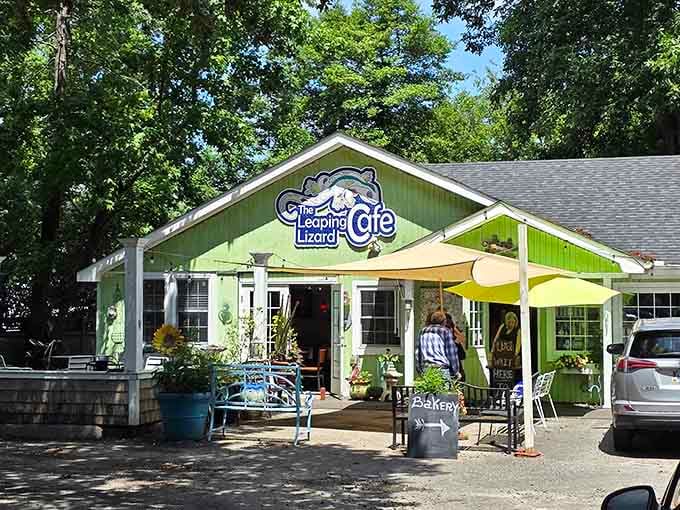 That cheerful green cottage with the yellow umbrella out front isn't selling garden supplies, it's serving breakfast dreams come true.