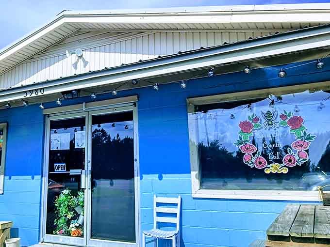 That cheerful blue exterior is your first clue that something special awaits inside this Burgaw treasure.