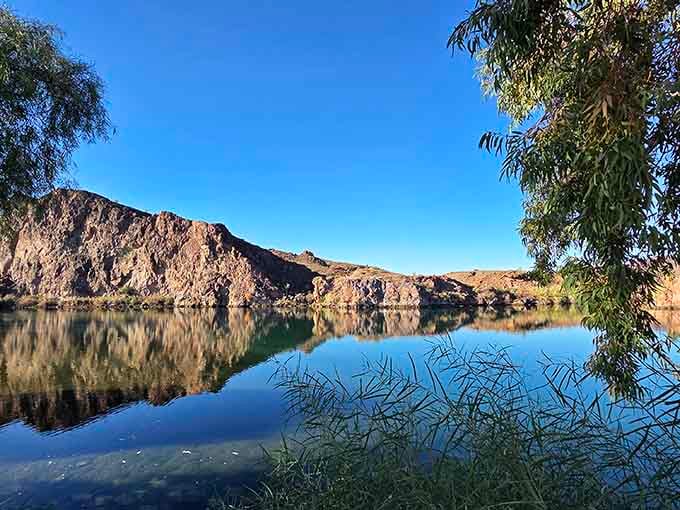 The mirror-like reflections on this calm morning create a scene so peaceful, even your blood pressure drops just looking at it.