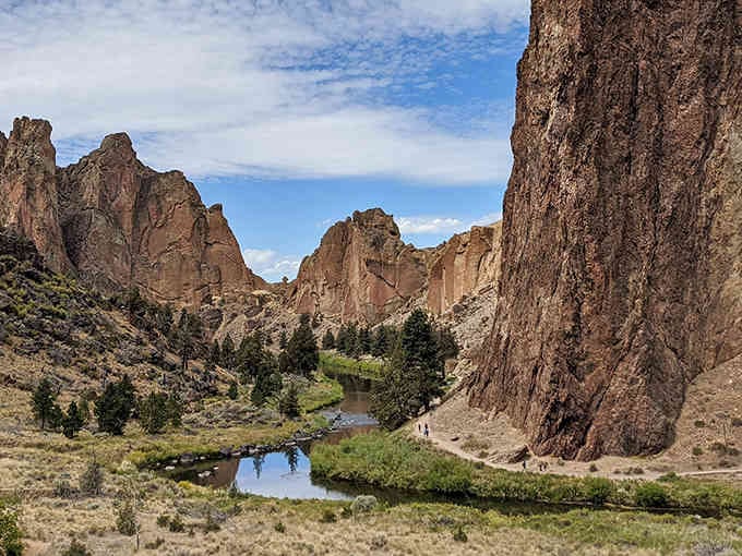 The Crooked River snakes through towering volcanic spires like nature's own theme park, minus the overpriced souvenirs.