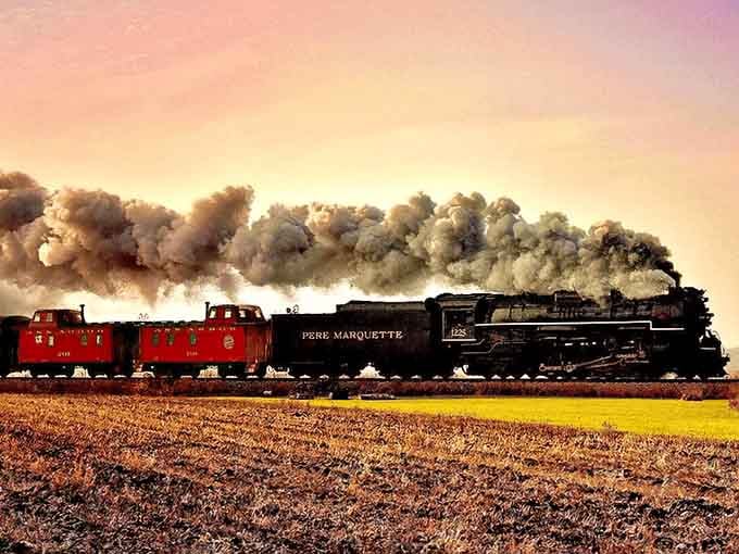 The Pere Marquette 1225 cuts through Michigan farmland like a time machine on rails, billowing steam and pure nostalgia.