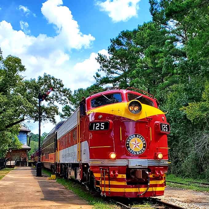 That red and yellow locomotive looks ready to transport you straight into a vintage postcard from Texas's golden age.
