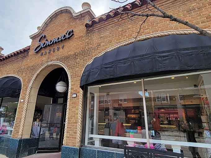 That classic brick facade with elegant awnings whispers "quality" louder than any billboard ever could.