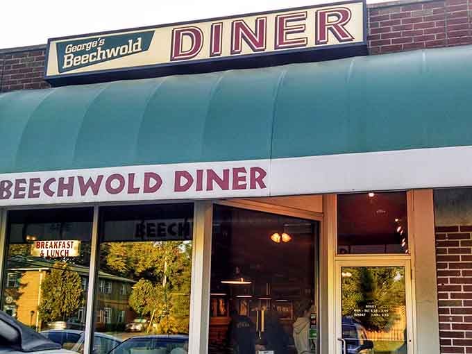 The reflection in those windows shows the neighborhood, but inside awaits something even better: legendary burgers.