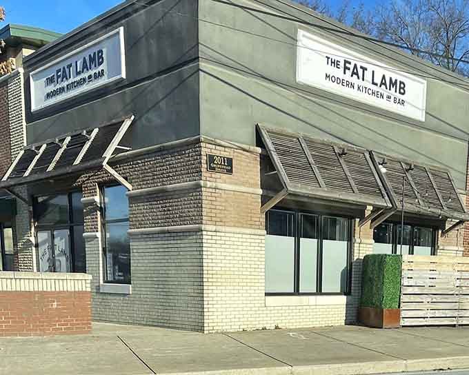 The Fat Lamb's inviting storefront promises culinary adventures that'll make your taste buds sing show tunes.