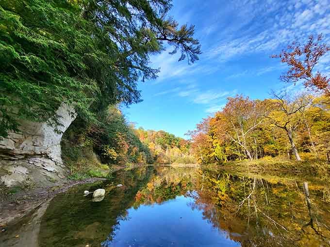 When fall decides to show off at Shades State Park, even the water stops to admire its own reflection.