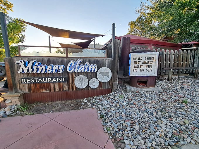That rustic sign and river rock landscaping announce you've arrived somewhere special in small-town Colorado.