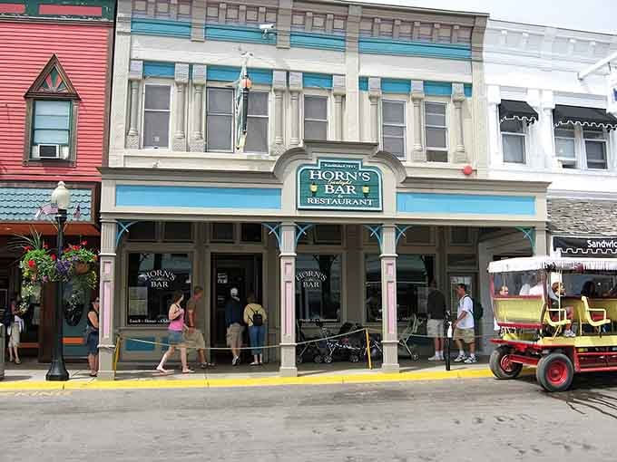 That turquoise and cream facade isn't just pretty, it's practically a time machine with a welcome mat attached.
