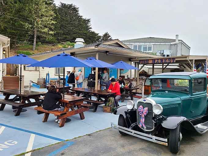 The picnic tables and blue umbrellas signal you've arrived at seafood paradise on the marina.