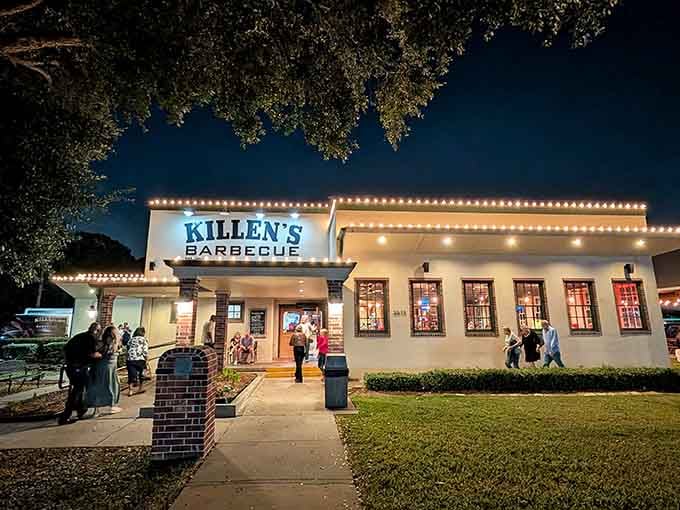 That unassuming white building with the brick columns is your gateway to barbecue enlightenment and possible meat sweats.