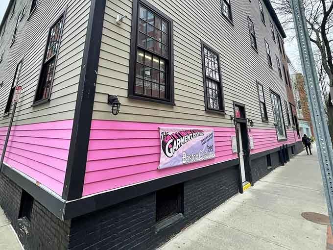 The building wears its pink stripe like a badge of honor, impossible to miss and unapologetic about it.