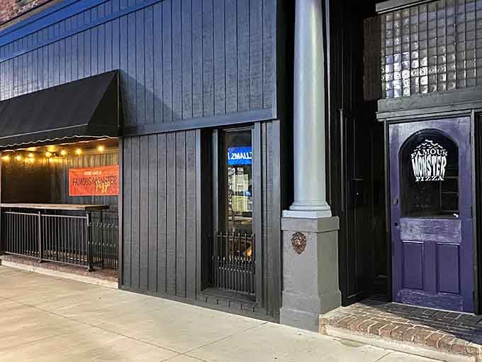 The charming storefront beckons with promises of pizza and pleasantly spooky surprises waiting inside.