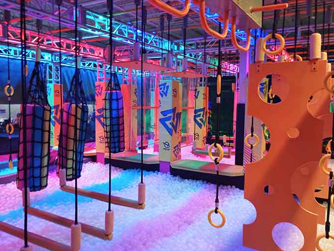 Neon-lit obstacle courses that make your childhood playground look like it wasn't even trying.