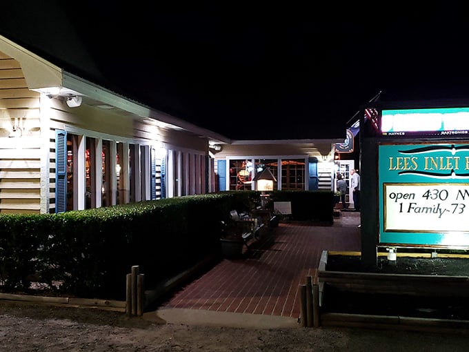 When the sun goes down, Lee's Inlet Kitchen lights up like a beacon for seafood lovers, proving that the best dinners often happen after dark.