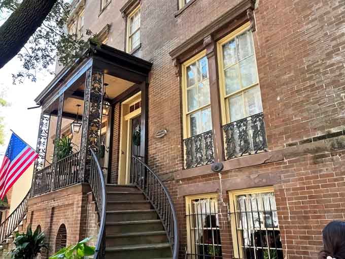 That historic brick facade and those welcoming stairs are your gateway to Southern food paradise in downtown Savannah.