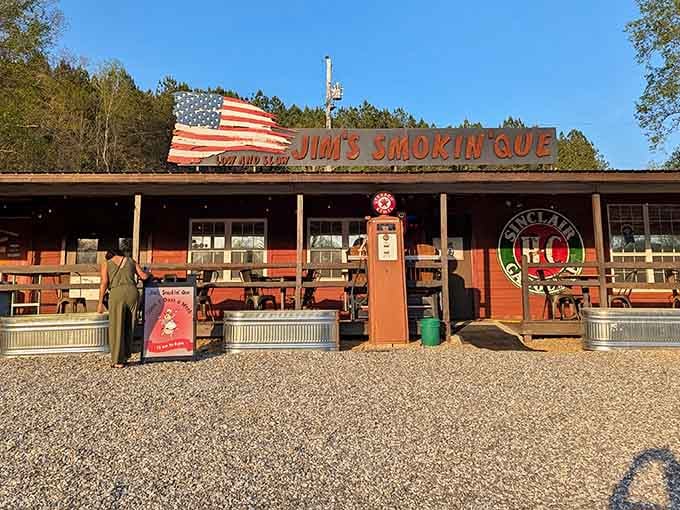 The vintage gas pump and American flag tell you everything about priorities here: patriotism, nostalgia, and seriously good meat.