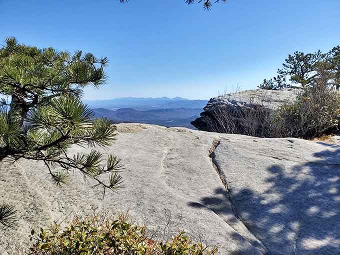 That's the famous rock ledge everyone's talking about, jutting out like nature's own selfie station with mountain views.