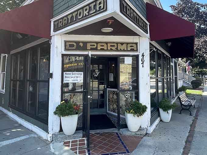 That charming corner entrance with the planters flanking the door promises something special waiting inside for you.