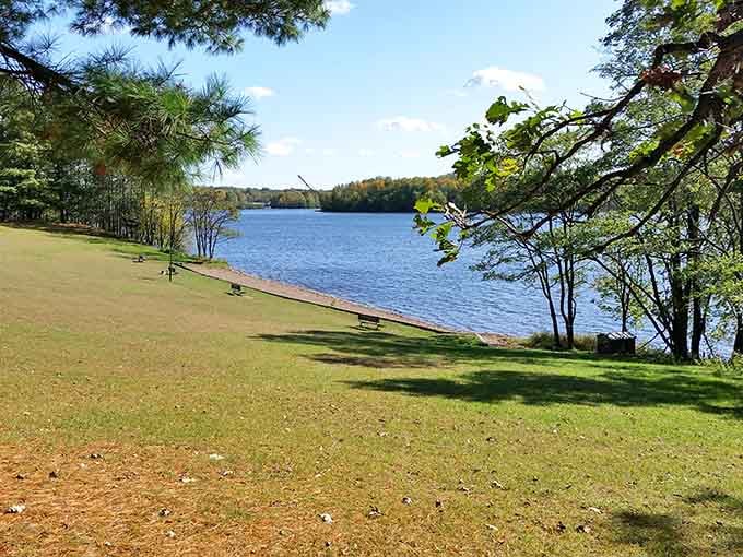 This tranquil shoreline proves that sometimes the best seat in the house doesn't need cushions or a roof.