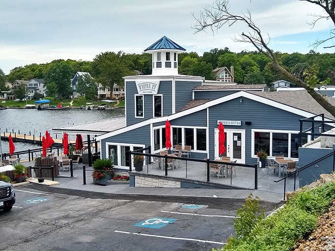 That blue and white exterior with the cheerful red umbrellas promises good times ahead on the water.