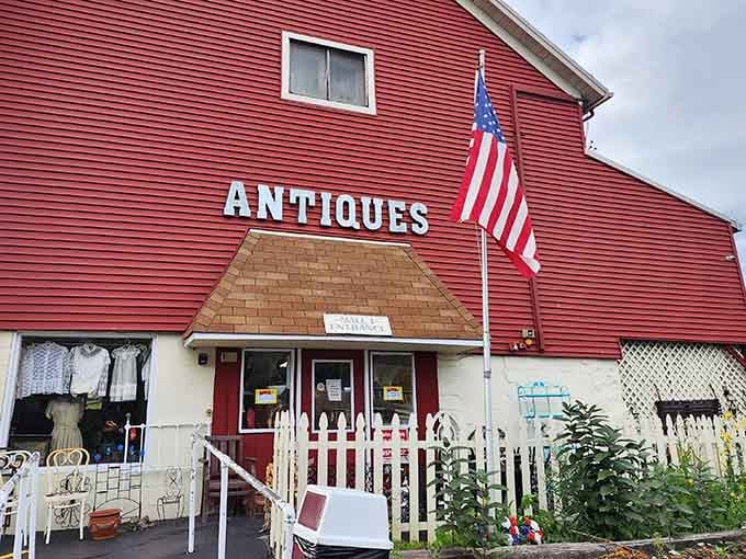 The white picket fence and American flag set the stage for your journey into decades past.