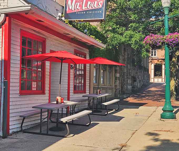 Those red umbrellas aren't just for show &ndash; they're shading some seriously happy diners enjoying Michigan's best chicken.