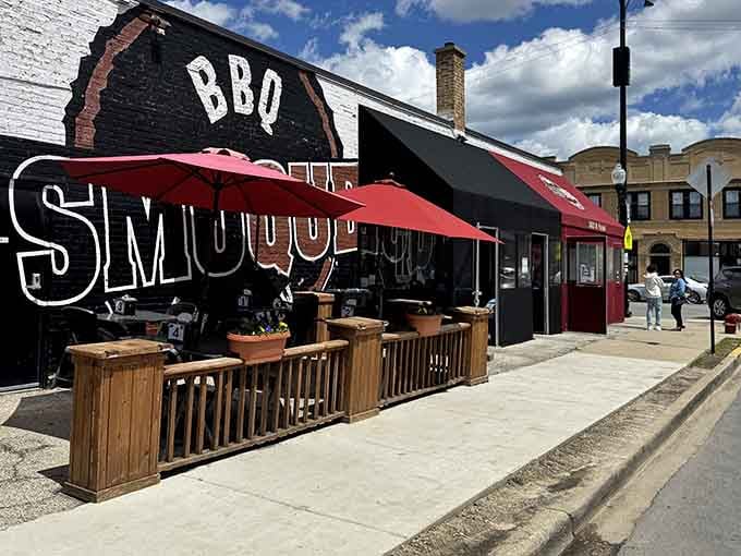 Simple signage and a welcoming patio prove that great barbecue doesn't need fancy architecture, just honest smoke and dedication.
