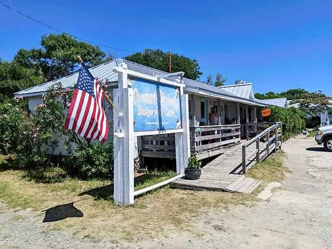Stars and Stripes flying proudly over weathered white siding, this island bakery wears its patriotism as comfortably as old jeans.