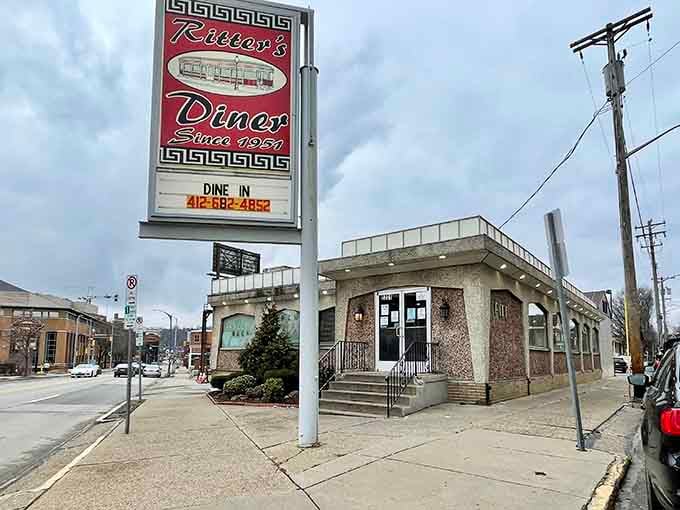 That classic sign beckons like a lighthouse for hungry souls seeking refuge from modern dining chaos.