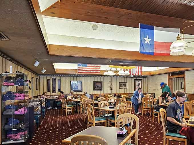 The Texas flag flies proudly above a dining room where locals gather for meals that feel like coming home.