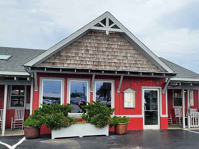 That cheerful red exterior practically waves you over like a friendly neighbor inviting you to dinner.