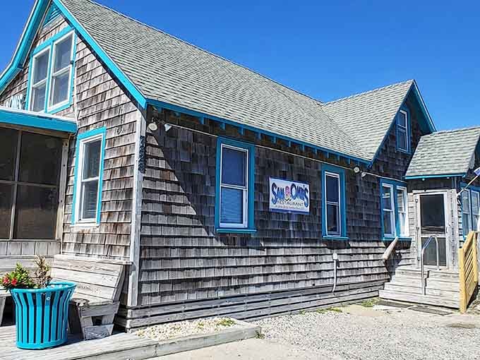 Weathered shingles and bright blue benches tell you everything: this place has earned its stripes, one breakfast at a time.
