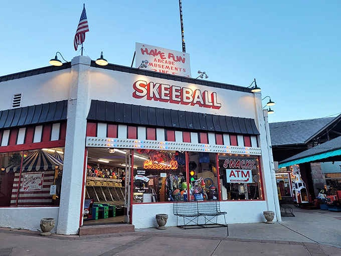 That red and white striped facade isn't just charming, it's a portal to simpler times when fun was mechanical.