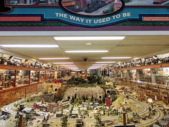 That massive model railroad layout isn't just impressive, it's basically a time machine you can stare at for hours.