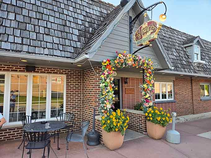 That charming brick facade and flower-adorned entrance promise the kind of meal your stomach will remember fondly.
