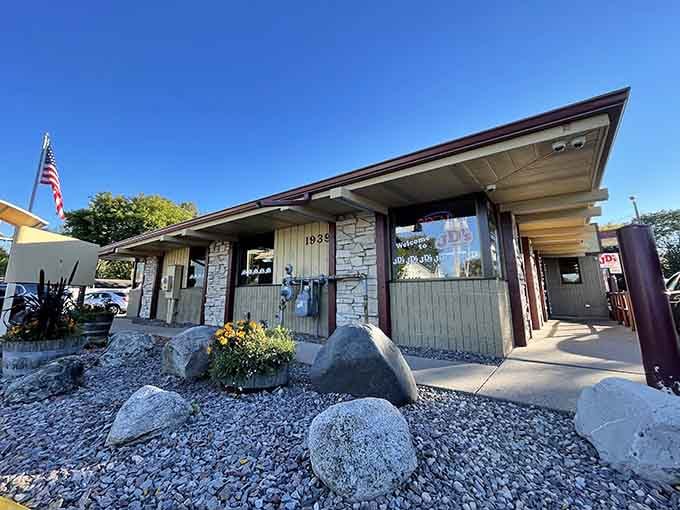 That mid-century roofline and stone facade aren't cosplaying vintage, they're the genuine article still standing proud.